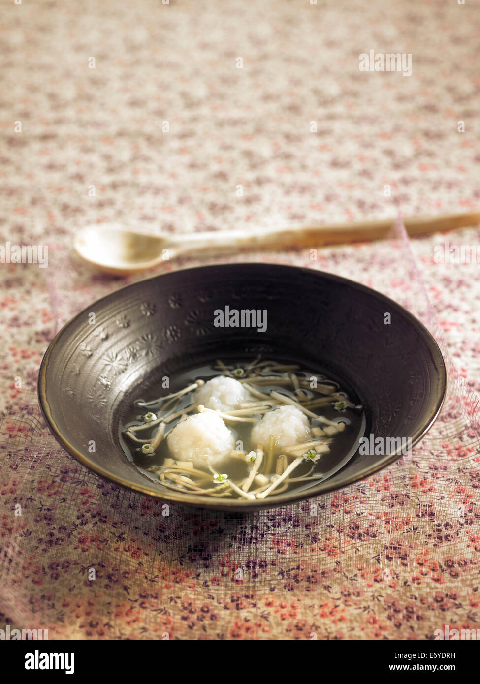 Broth with squid balls Stock Photo - Alamy