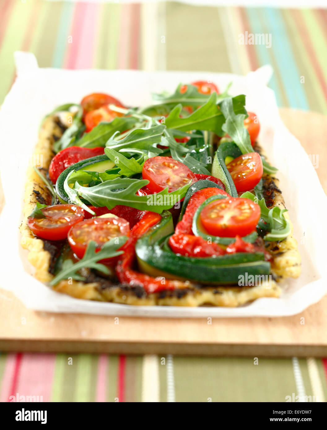 Tapenade,rocket and tomato savoury tart Stock Photo - Alamy