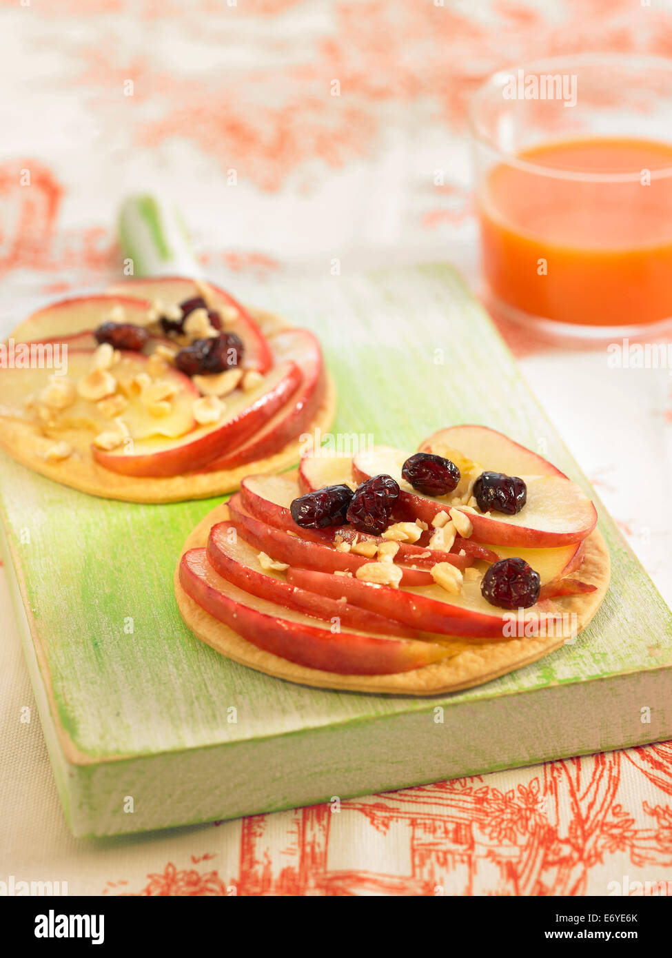 Apple and goji bean tartlets Stock Photo - Alamy
