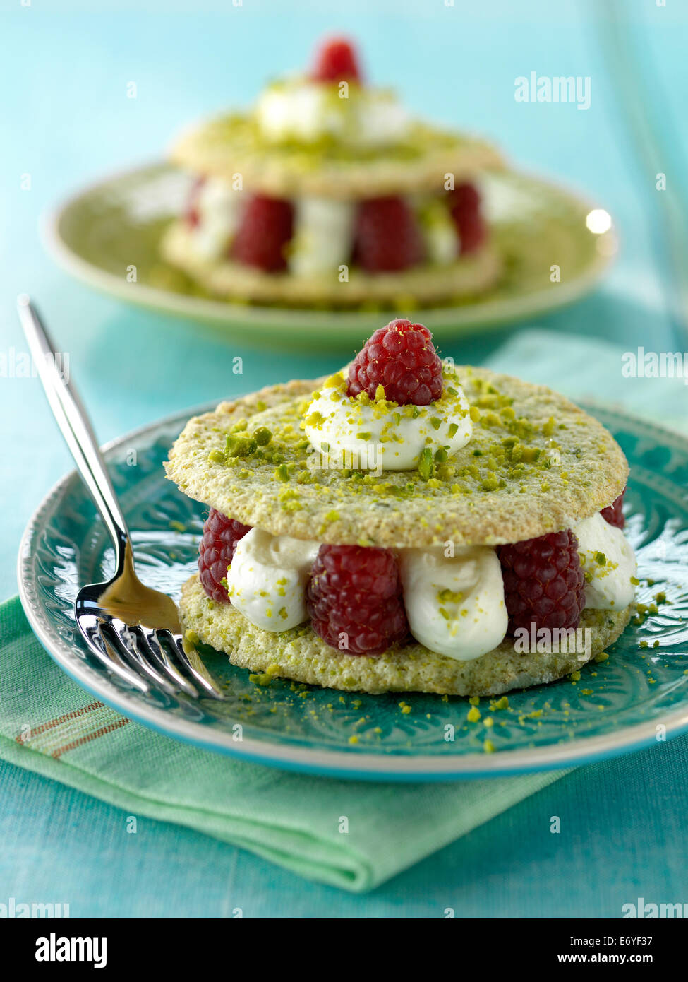 Pistachio and raspberry Dacquoise Stock Photo - Alamy