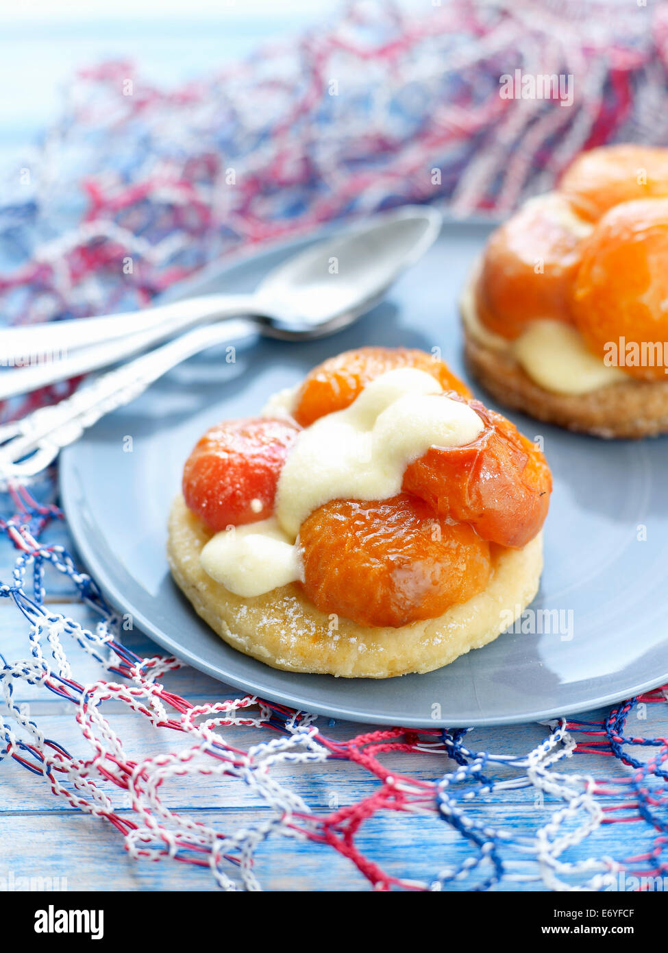 Pan-fried apricots and yoghurt mousse shortbread tartlets Stock Photo ...