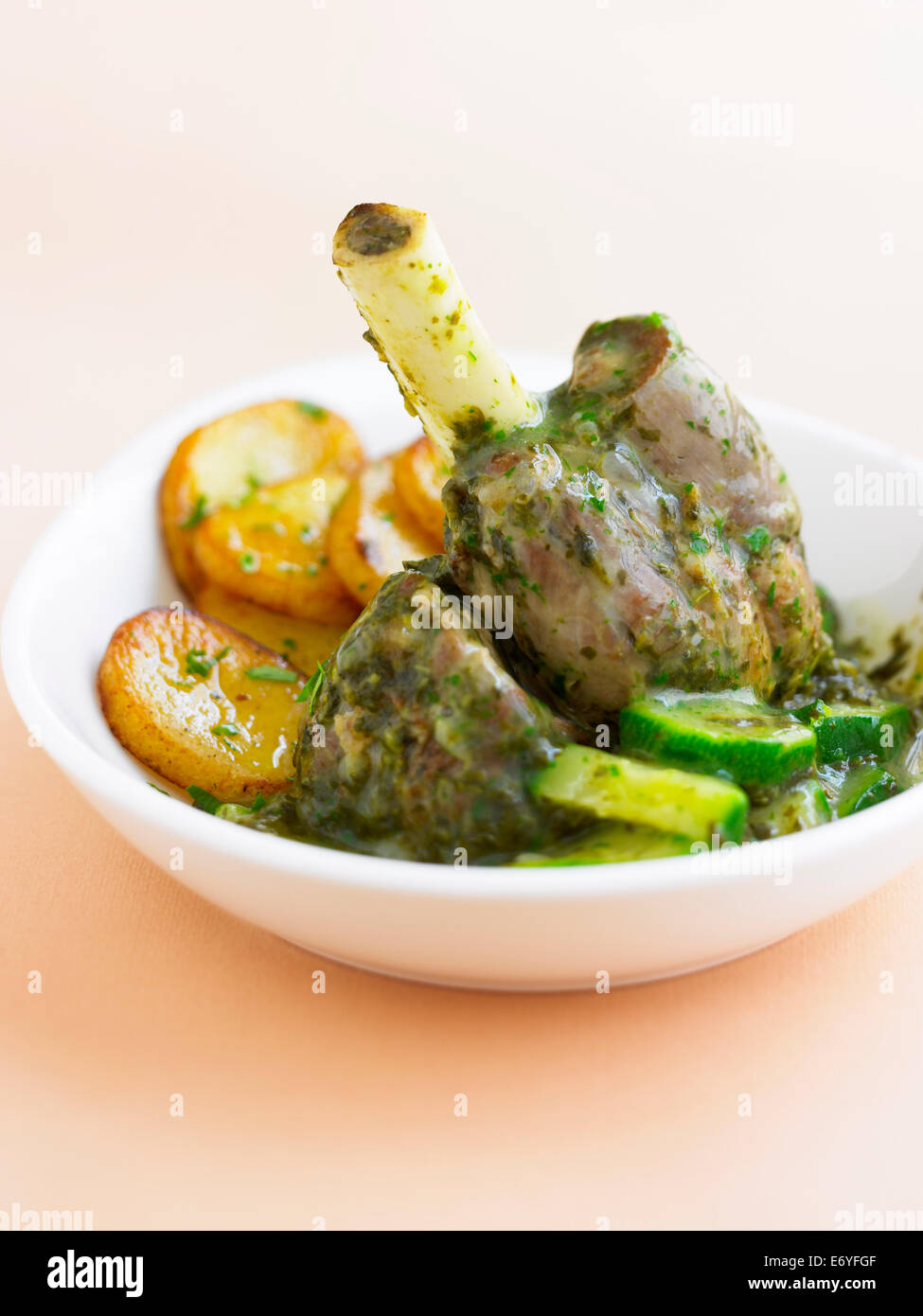 Knuckle of lamb with sorrel,zucchini and sauteed potatoes Stock Photo ...