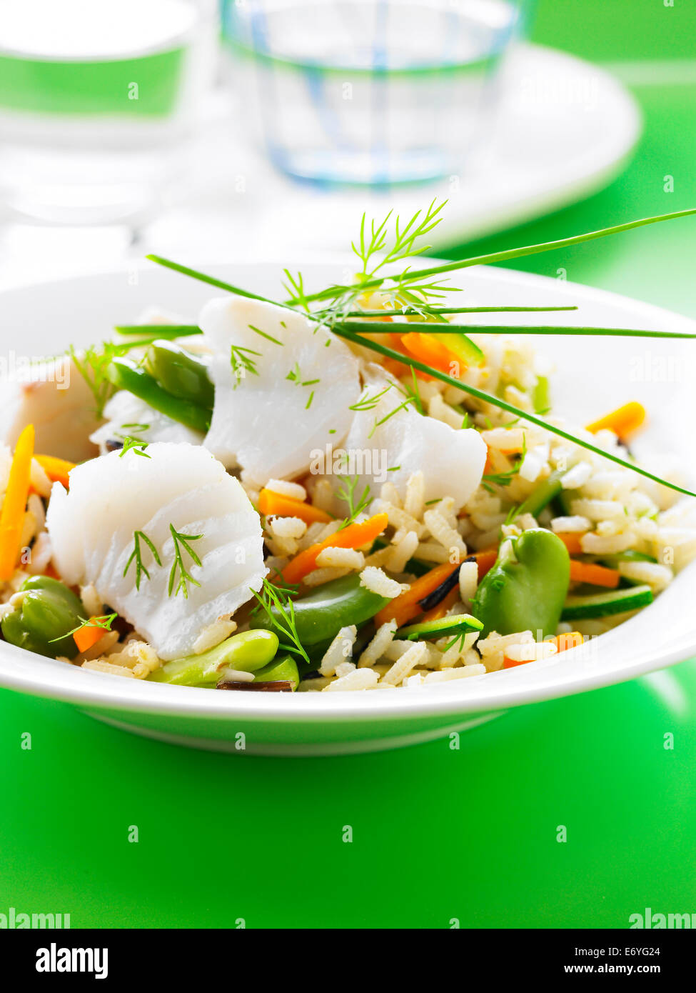 Cod with broad beans,rice and carrots Stock Photo - Alamy