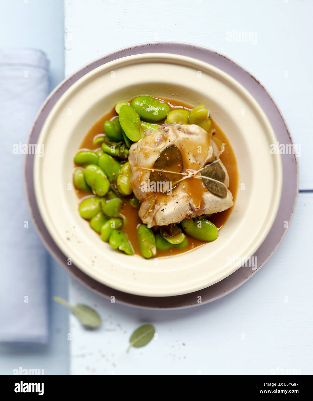 Rabbit with broad beans and sage Stock Photo - Alamy