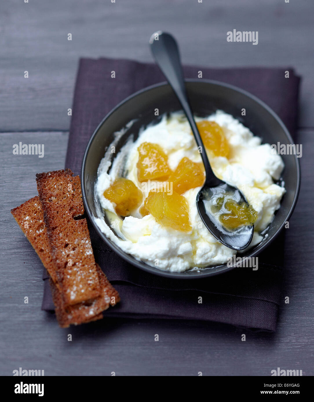 Faisselle with stewed pineapple Stock Photo - Alamy