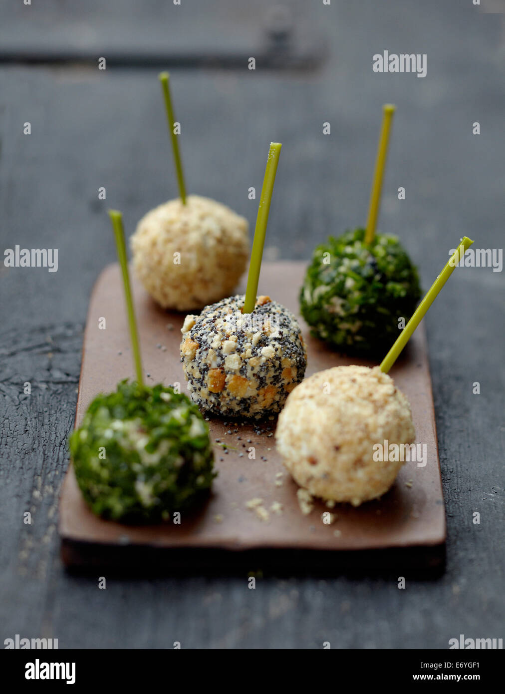 Three-flavored goat's cheese bites on sticks Stock Photo - Alamy
