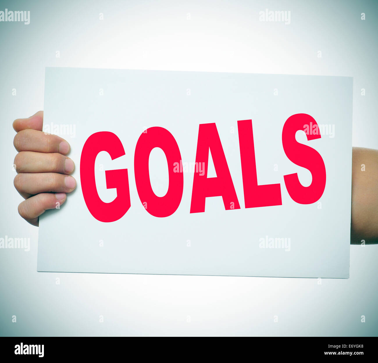 man hand holding a signboard with the word goals written in it Stock ...