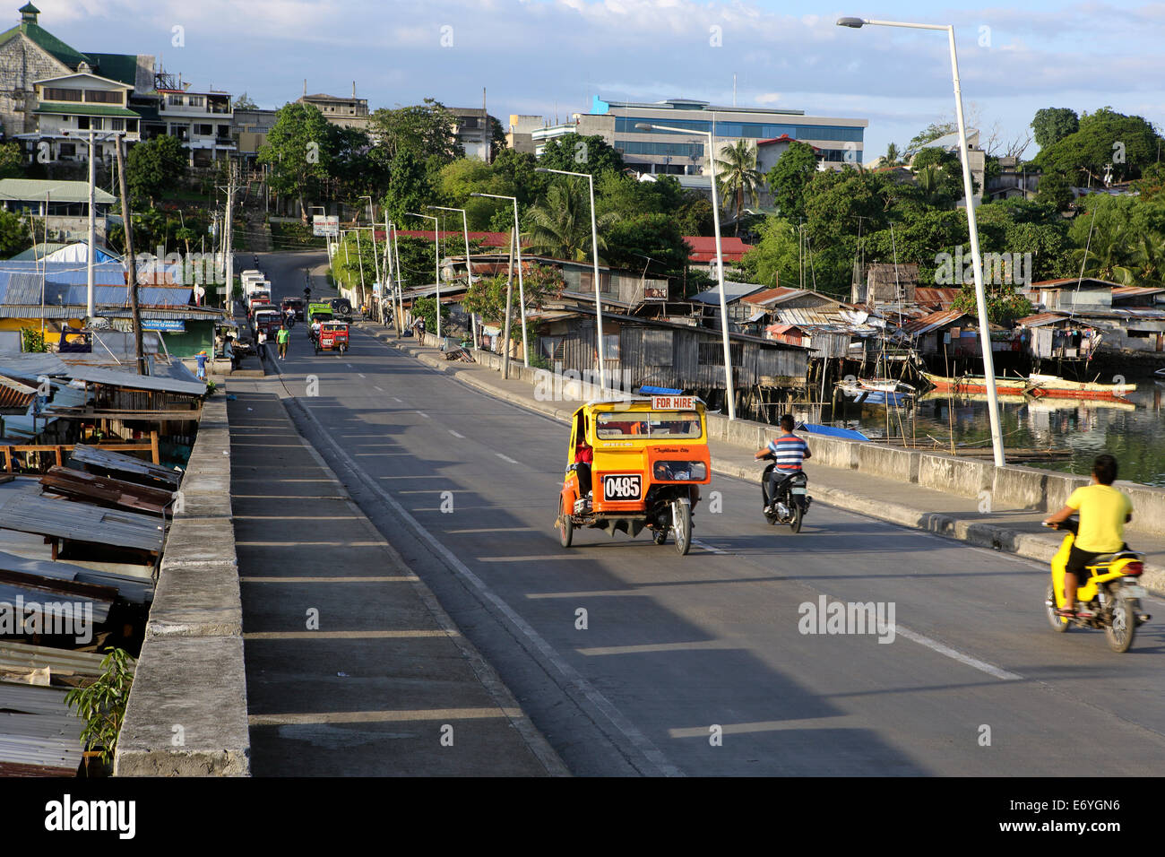 Motorcycle taxis and transport on bridge separating Panglao and Bohol ...