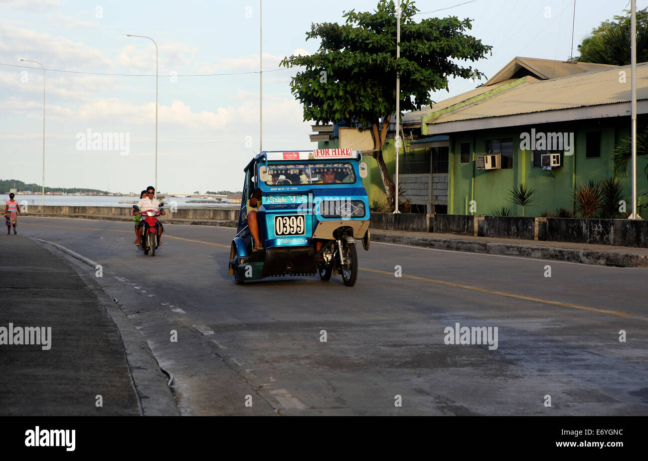 Motor taxi and motorbike riding along causeway to Panglao Island in ...