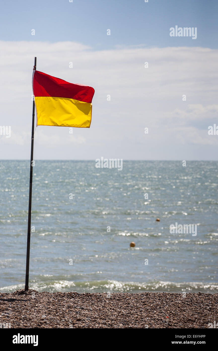 Lifeguard flag on the beach Stock Photo - Alamy