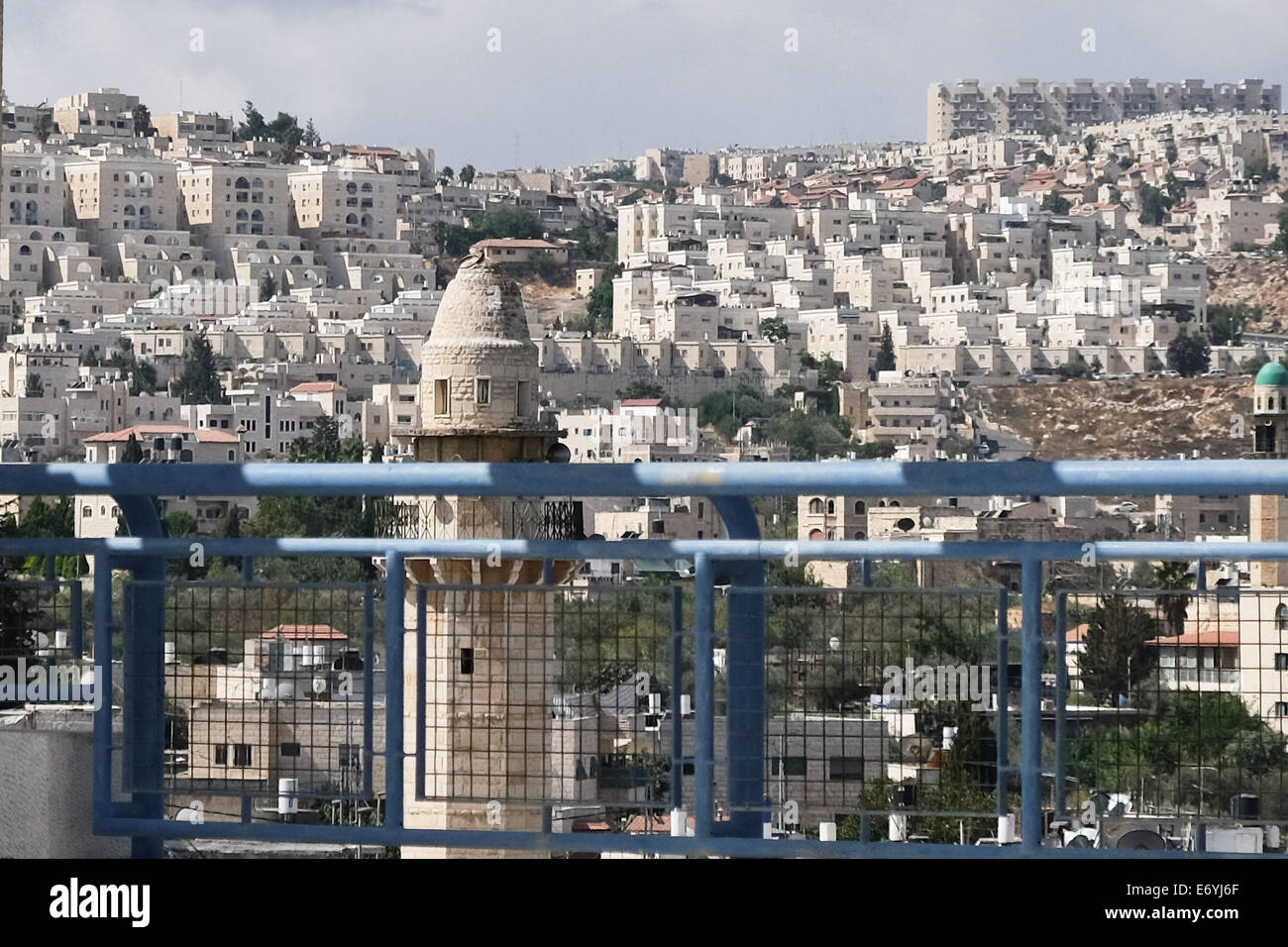 Bet Safafa mosque minaret with the Jewish neighborhood of Giloh in the ...