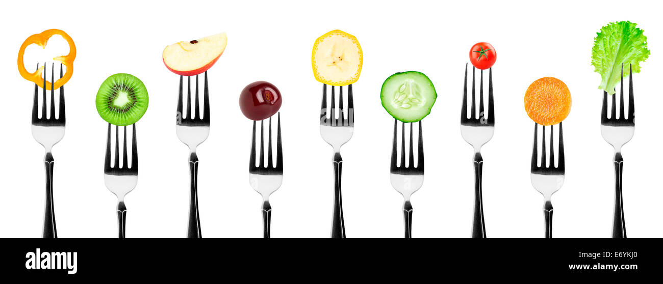 Fruits and vegetables on the forks. Healthy food Stock Photo - Alamy