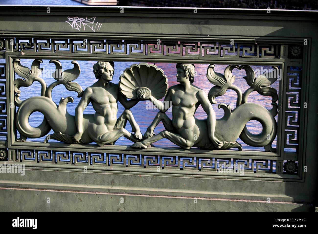 BERLIN, GERMANY: Graffiti mars ornamental railing with mythical figures ...