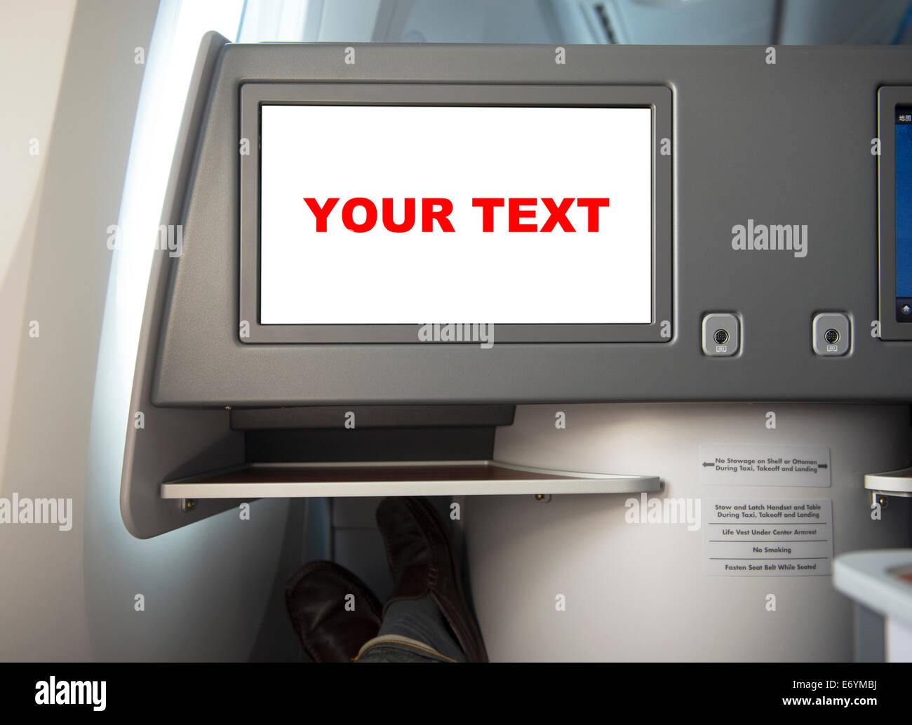 Flying screen on passenger seat Stock Photo - Alamy