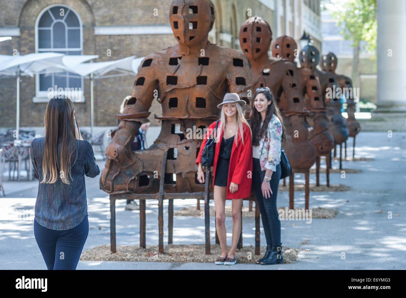 London, UK. 2nd Sept, 2014. visitors pose for pictures next to Xavier ...