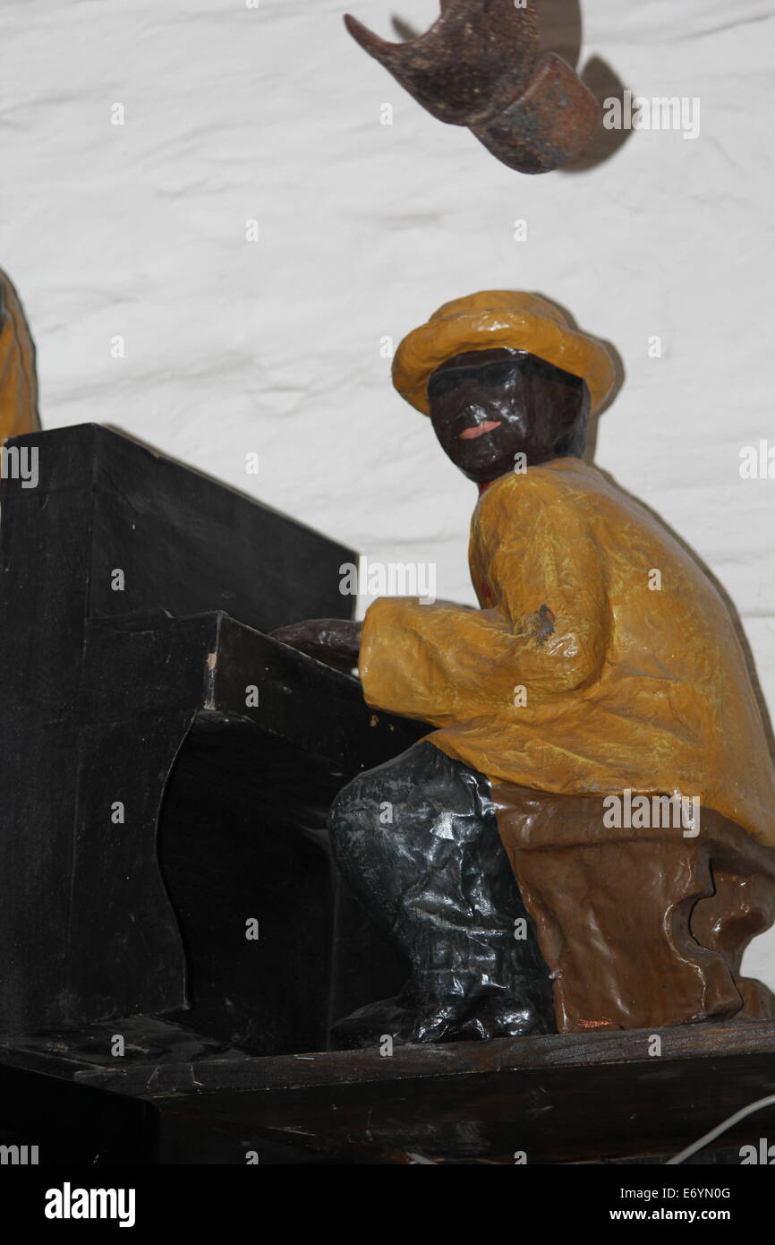 A sculptured image of a jazz band member displayed in a British pub ...