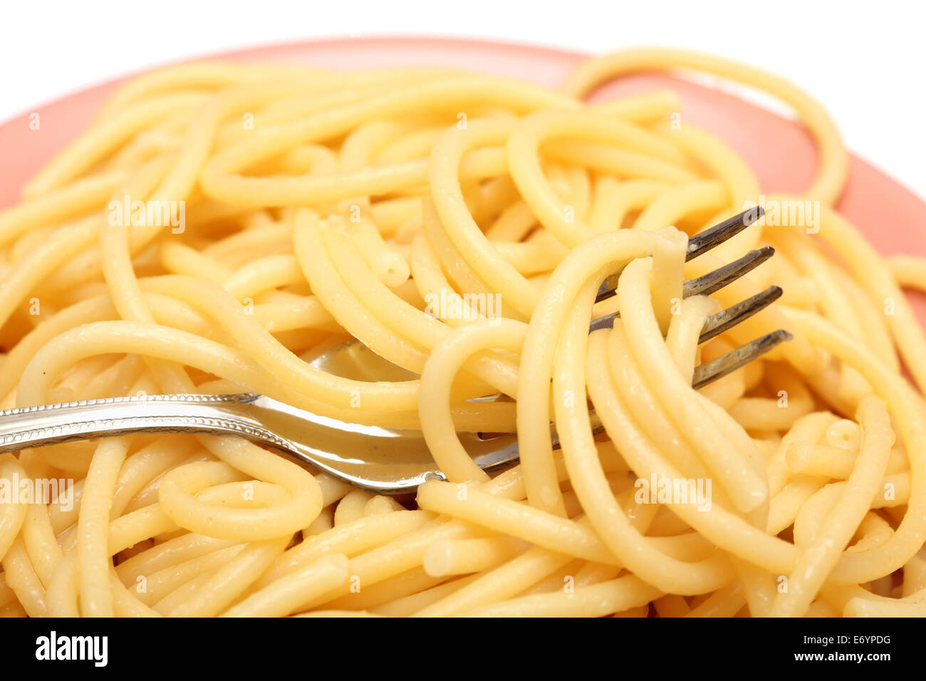 Pasta (Spaghetti) on a plate with fork. Closeup Stock Photo - Alamy