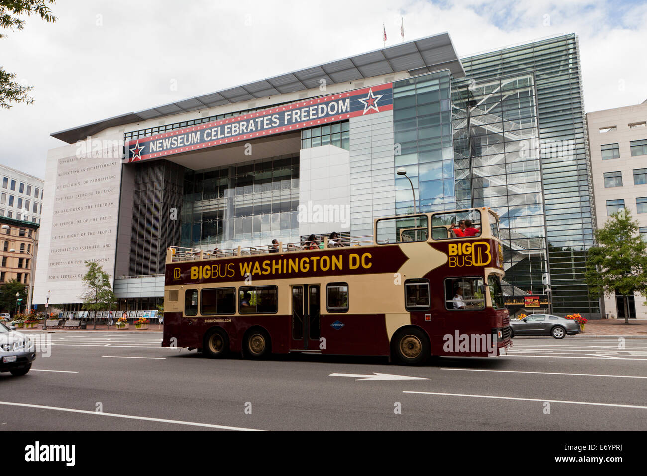 BigBus double decker tour bus driving by the Newseum building ...