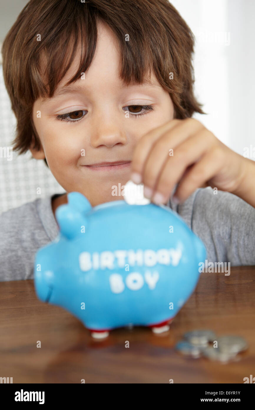 Young boy with piggy bank Stock Photo - Alamy