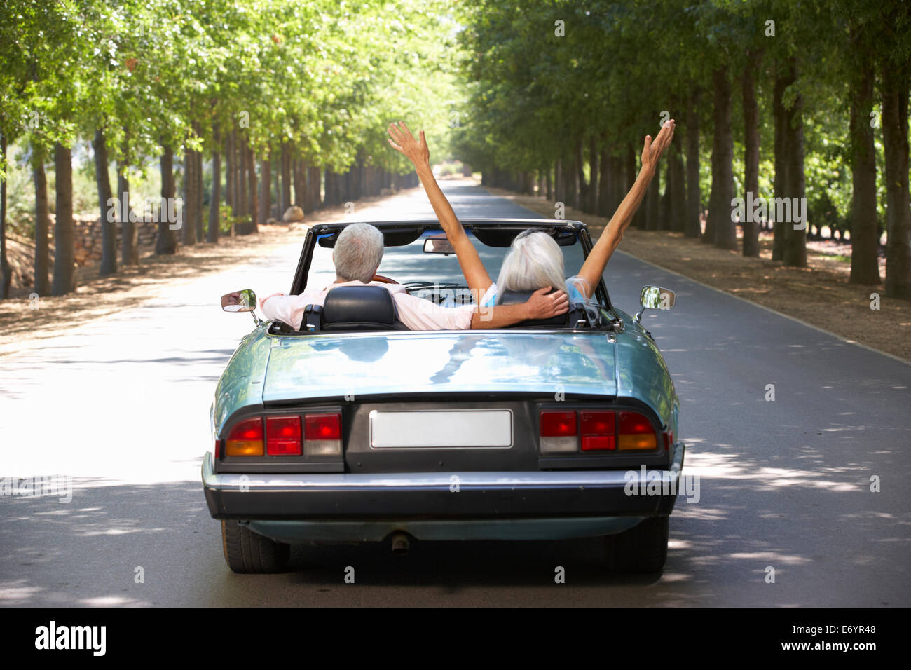 Senior couple in sports car Stock Photo - Alamy
