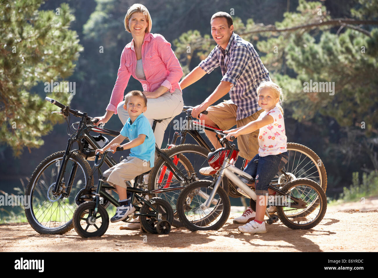 Young family on country bike ride Stock Photo - Alamy
