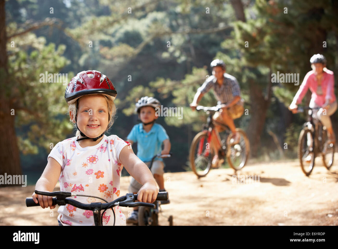 Young family on country bike ride Stock Photo - Alamy