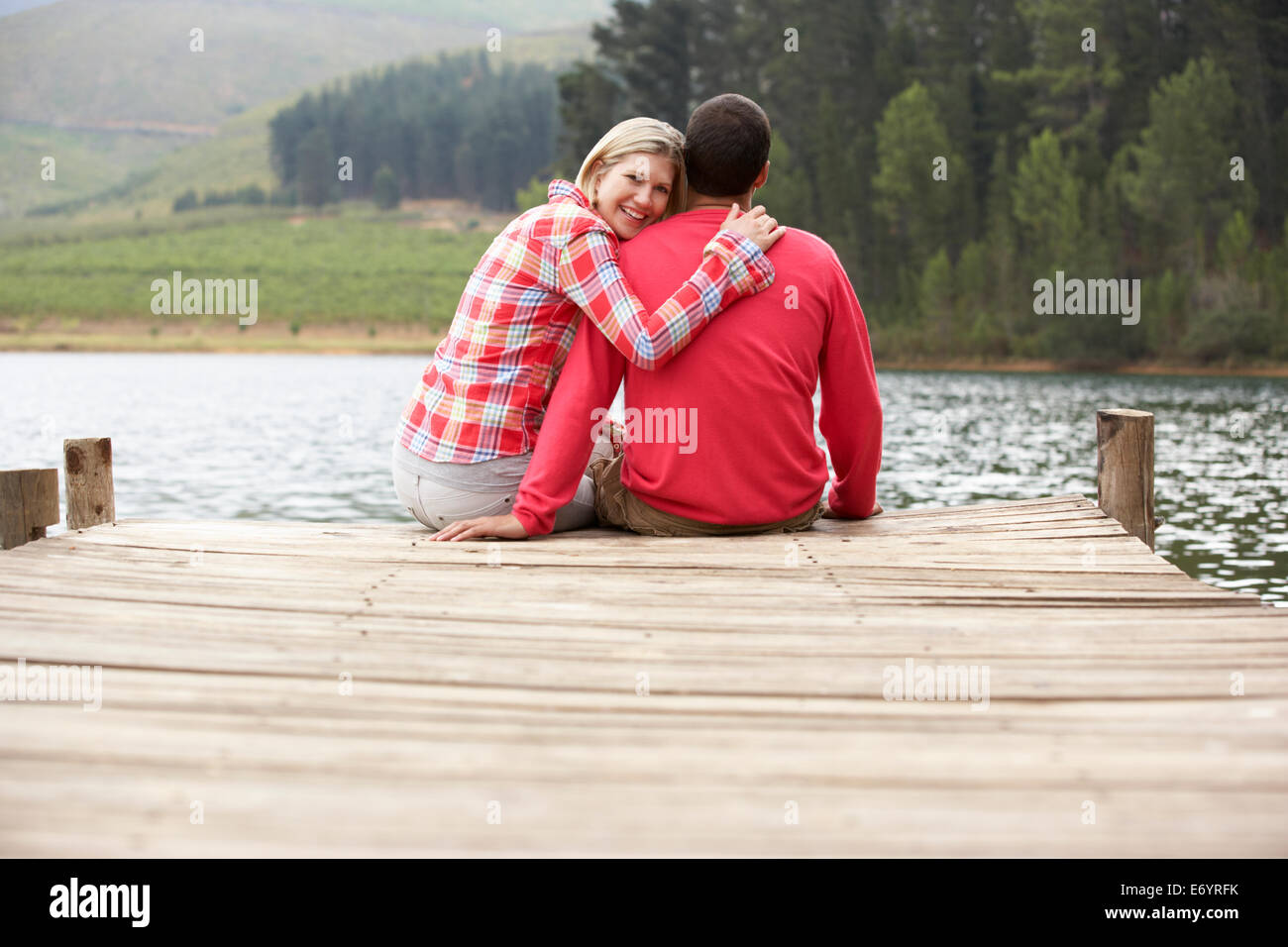 Loving couple sitting on river hi-res stock photography and images - Alamy