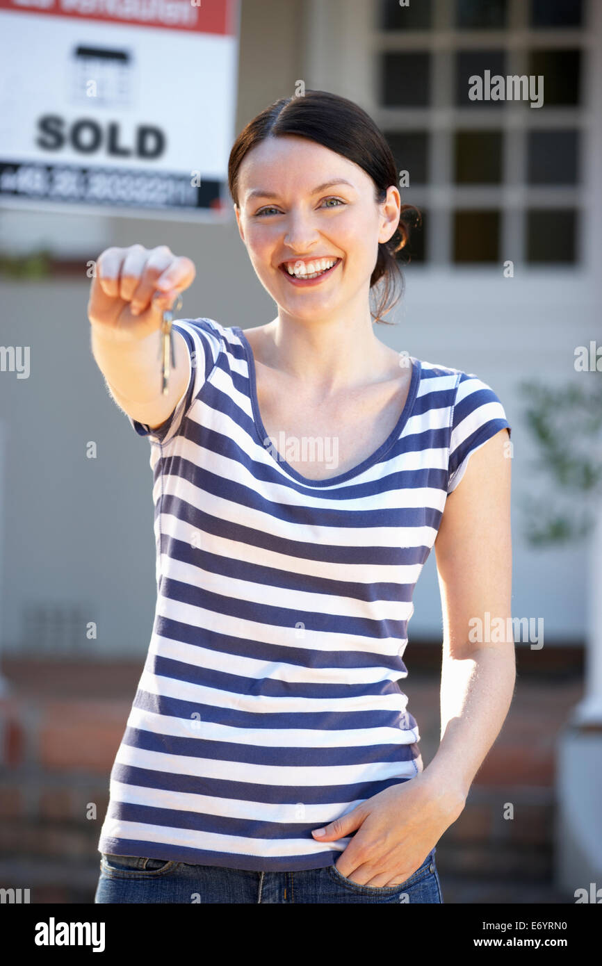 Woman moving into new home Stock Photo - Alamy