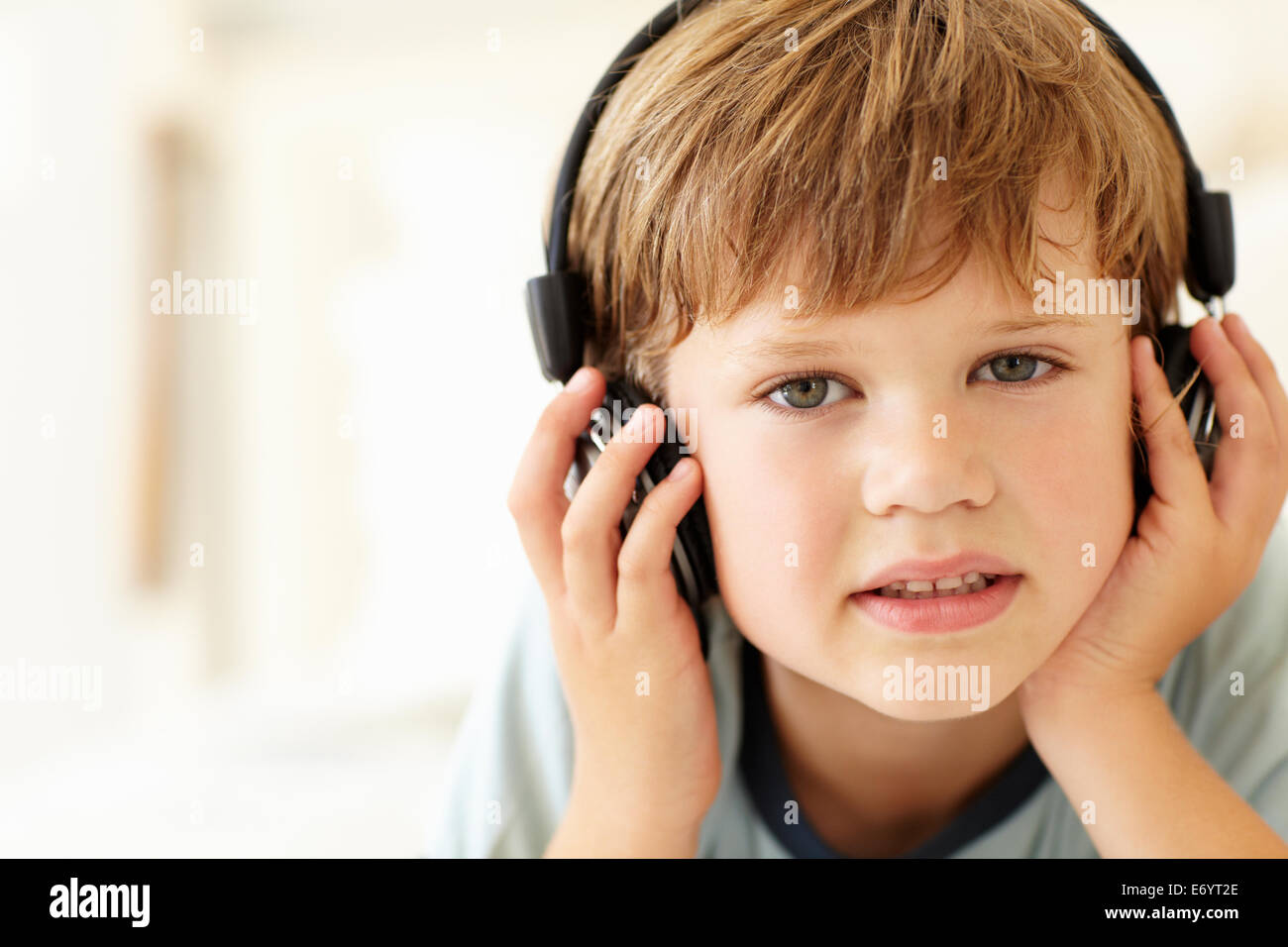 Young boy wearing headphones Stock Photo - Alamy