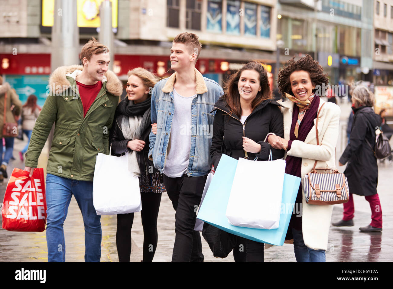 Group Of Young Friends Shopping Outdoors Together Stock Photo - Alamy