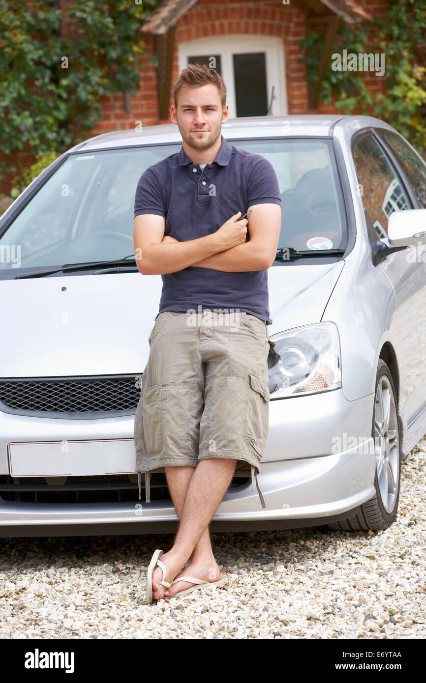 Young man with car Stock Photo - Alamy