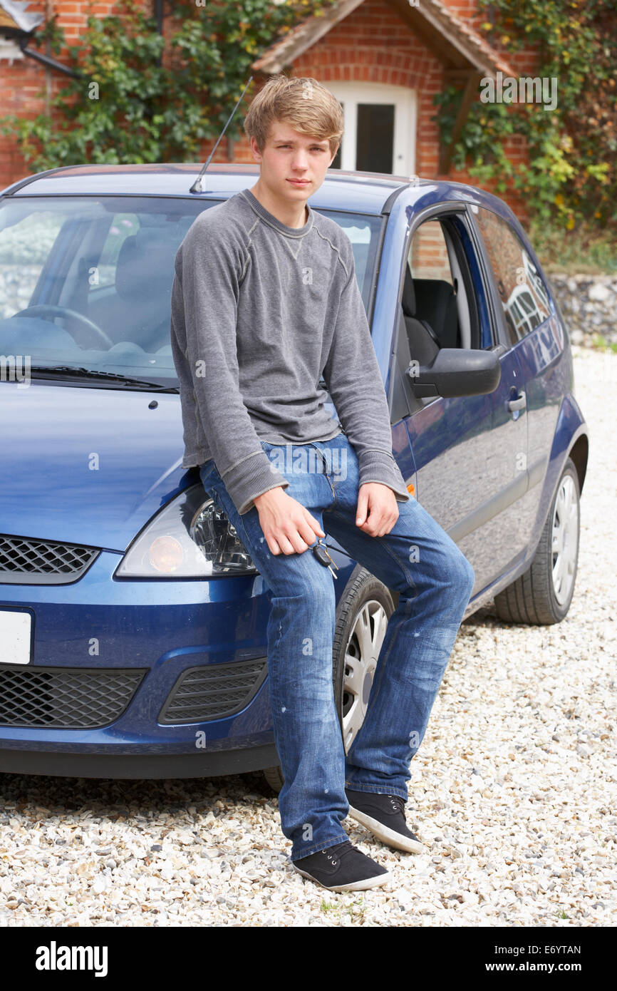 Young man with car Stock Photo - Alamy