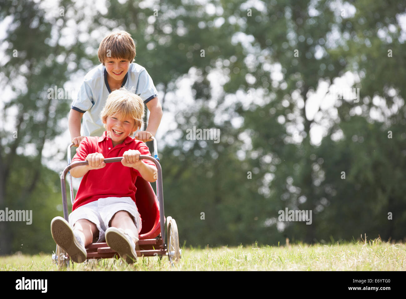 Boys Pushing Cart High Resolution Stock Photography and Images - Alamy