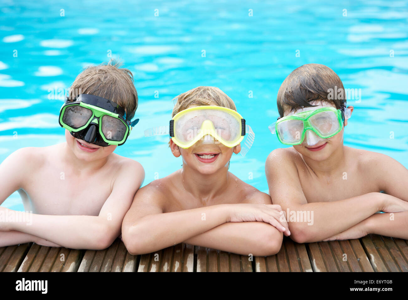 Family at home swimming pool uk hi-res stock photography and images - Alamy