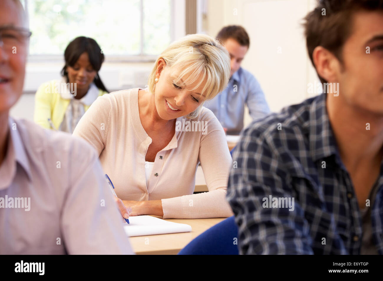 Senior student in class Stock Photo - Alamy