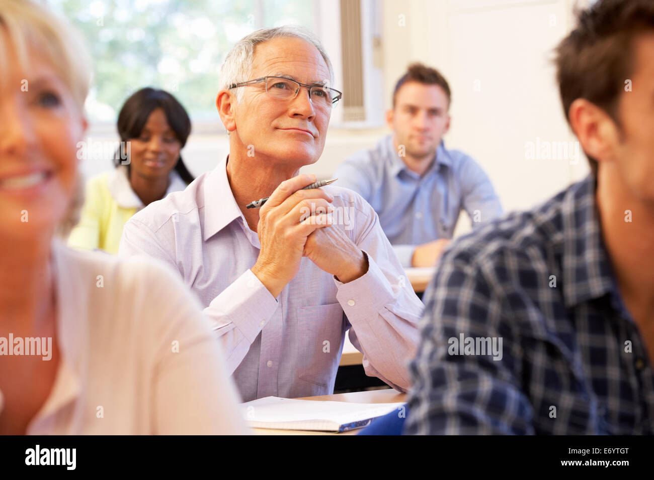 Senior student in class Stock Photo - Alamy