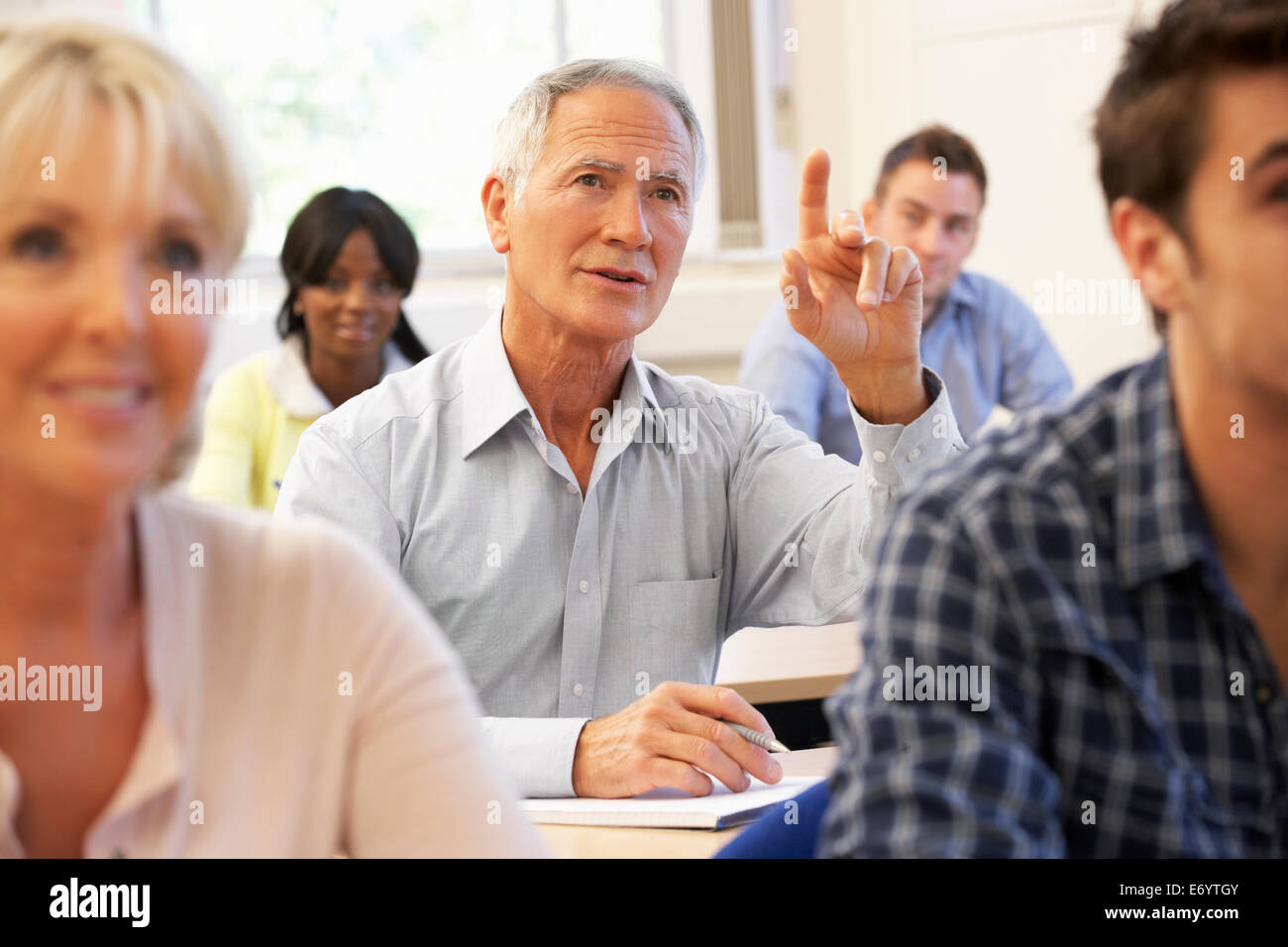 Senior student in class Stock Photo - Alamy