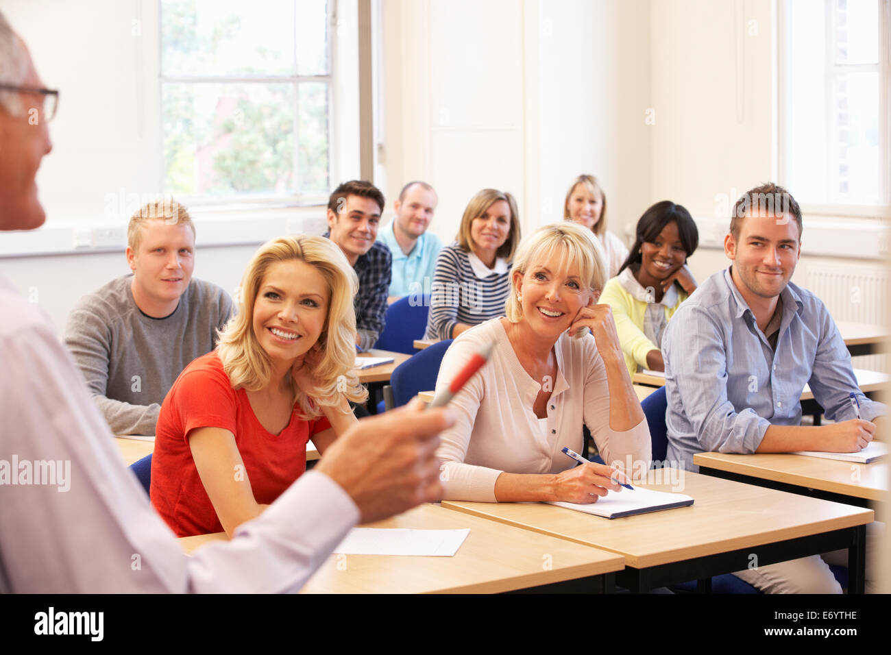 Senior tutor teaching class Stock Photo - Alamy