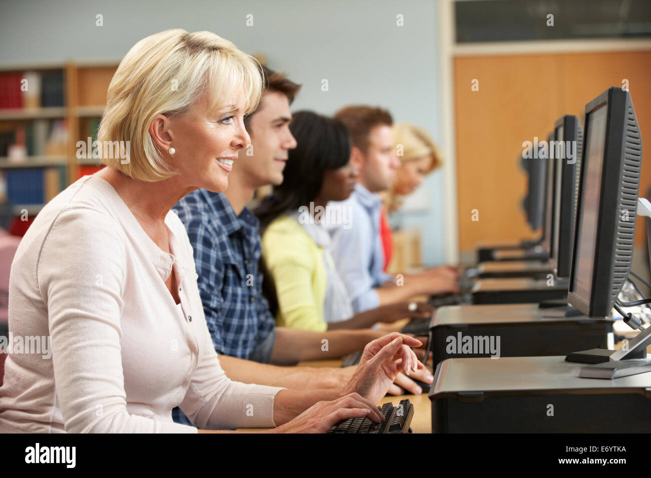 Students working on computers in library Stock Photo - Alamy