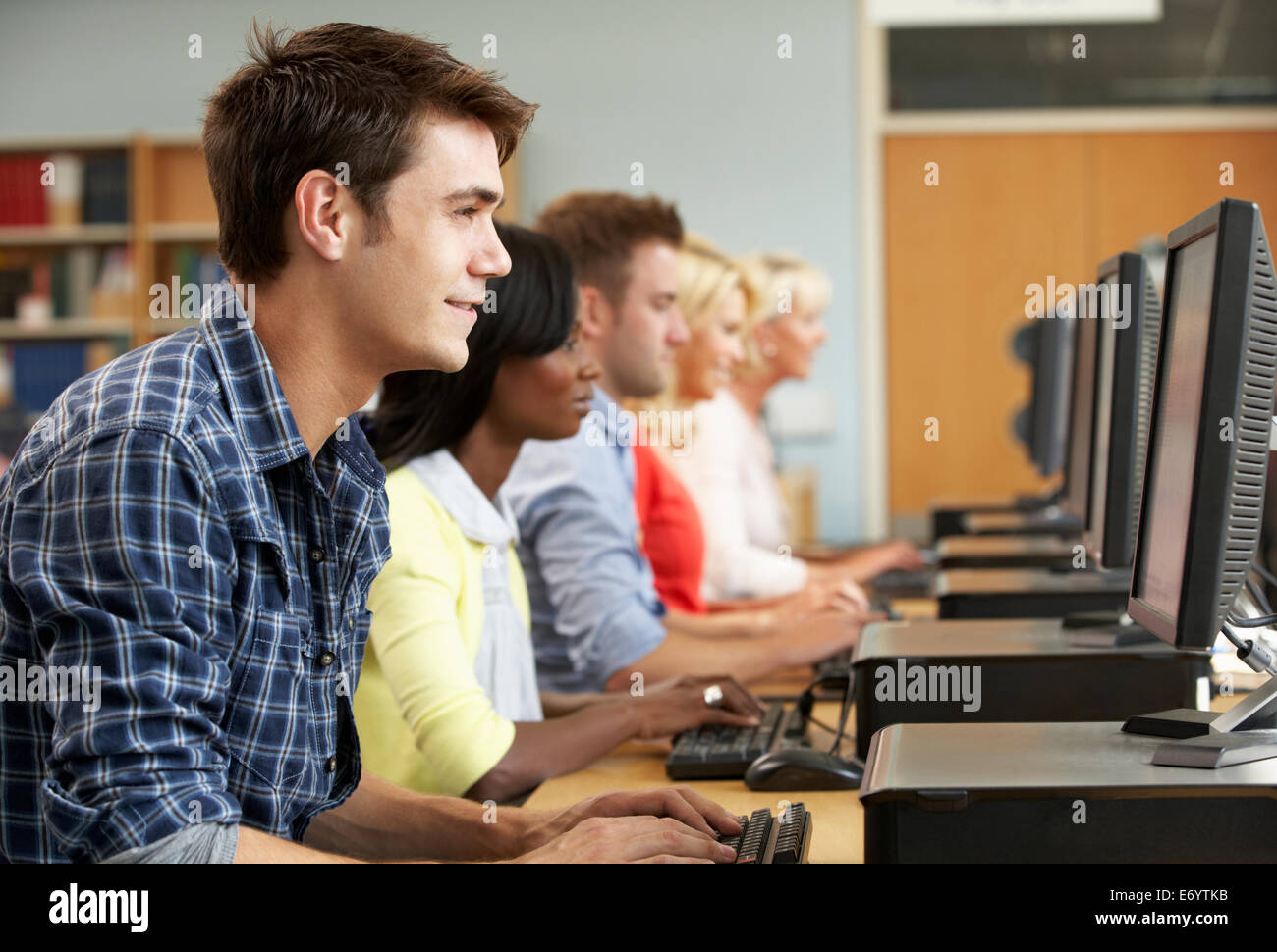 Students working on computers in library Stock Photo - Alamy