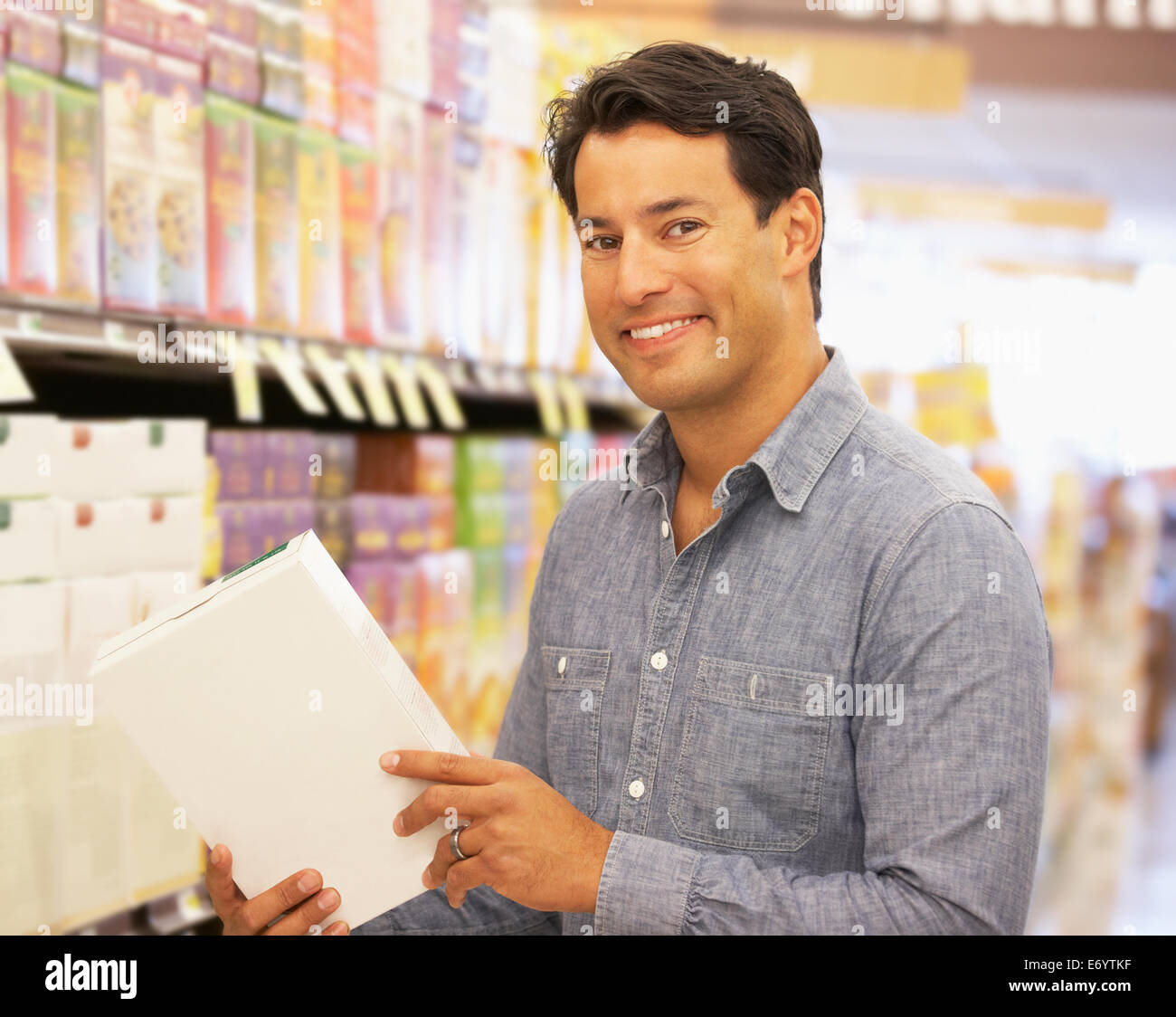 Man shopping in supermarket Stock Photo - Alamy