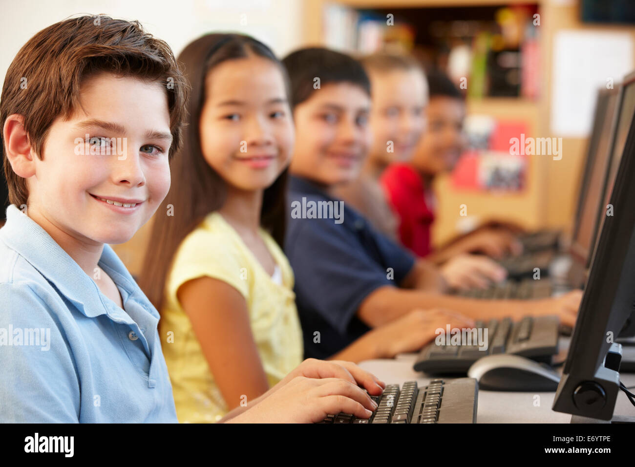 Schoolchildren working on computers Stock Photo - Alamy
