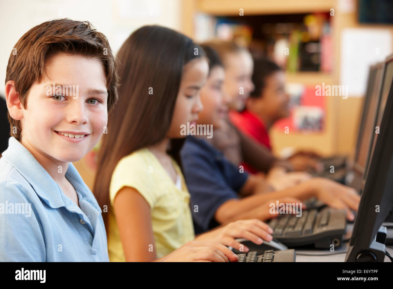 Schoolchildren working on computers Stock Photo - Alamy