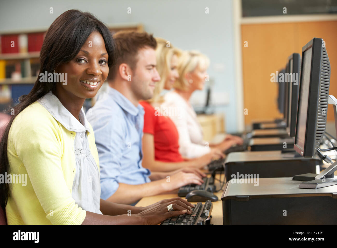 Students working on computers in library Stock Photo - Alamy
