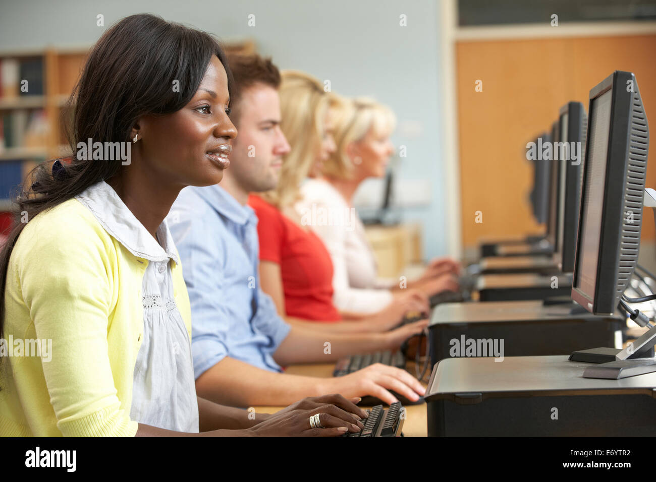 Students working on computers in library Stock Photo - Alamy
