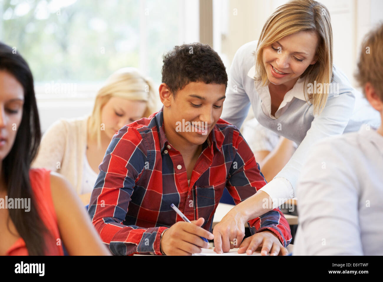 Students and tutor in class Stock Photo - Alamy