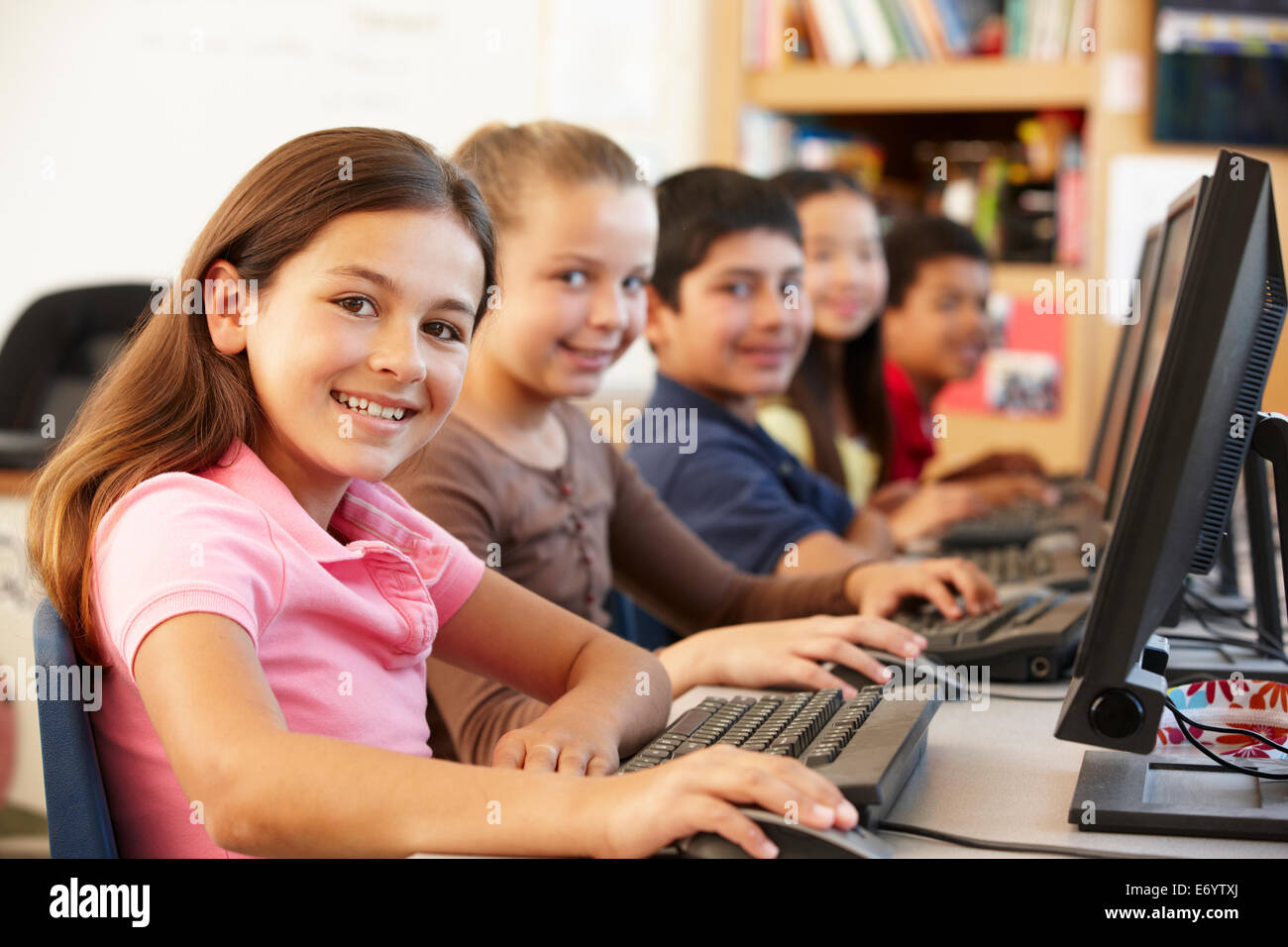 Schoolchildren working on computers Stock Photo - Alamy