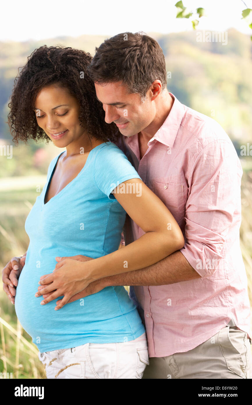 Expectant couple outdoors in countryside Stock Photo - Alamy
