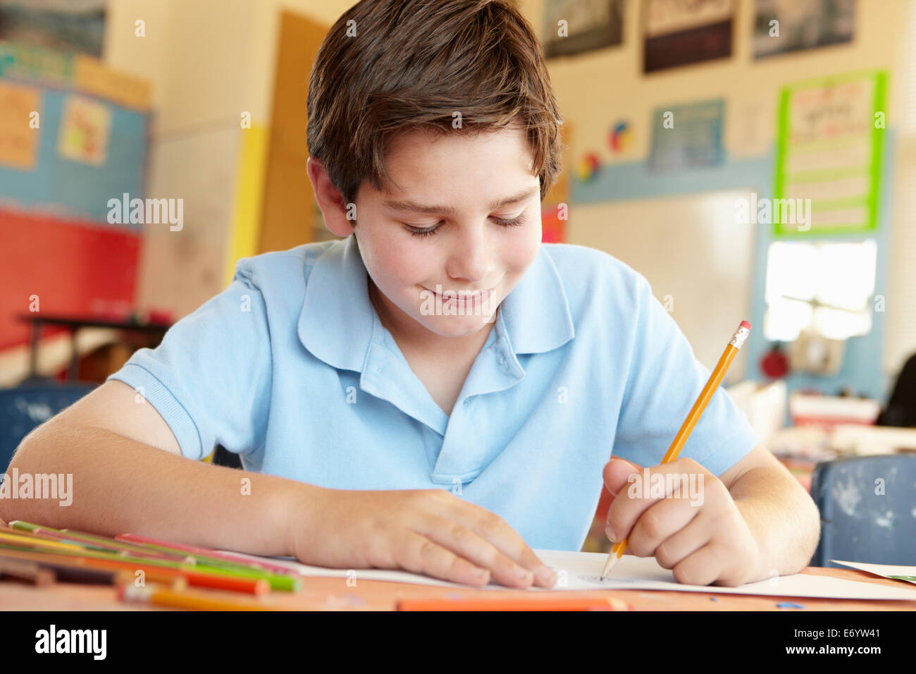 Pre teen boy in art class Stock Photo - Alamy