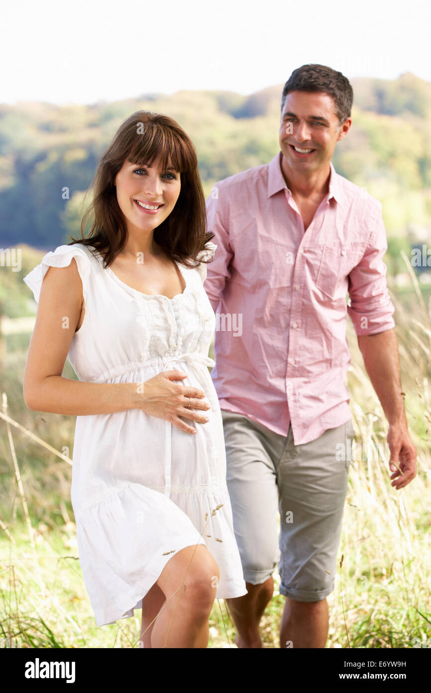 Expectant couple outdoors in countryside Stock Photo - Alamy
